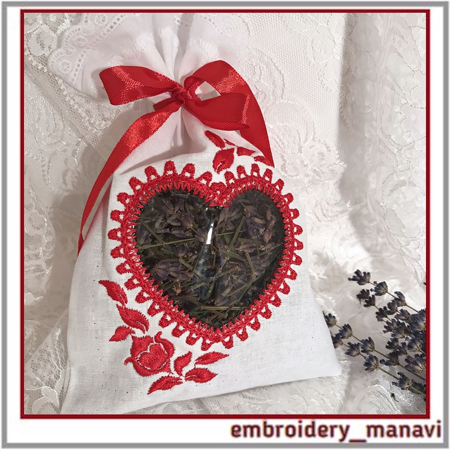 Embroidery design of a heart-shaped window with flowers. - Inspire Uplift