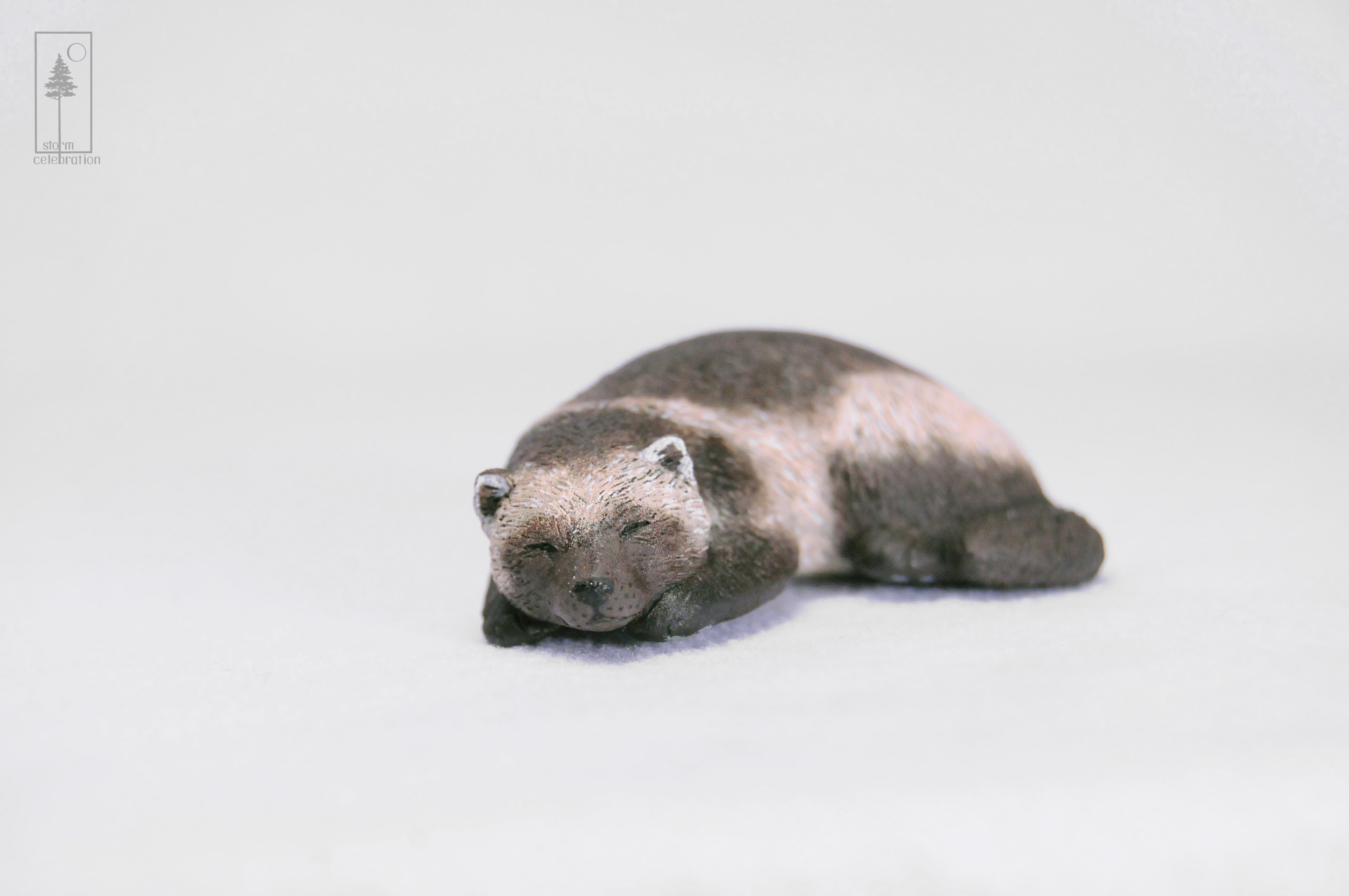 Sleeping wolverine gulo figurine | Inspire Uplift