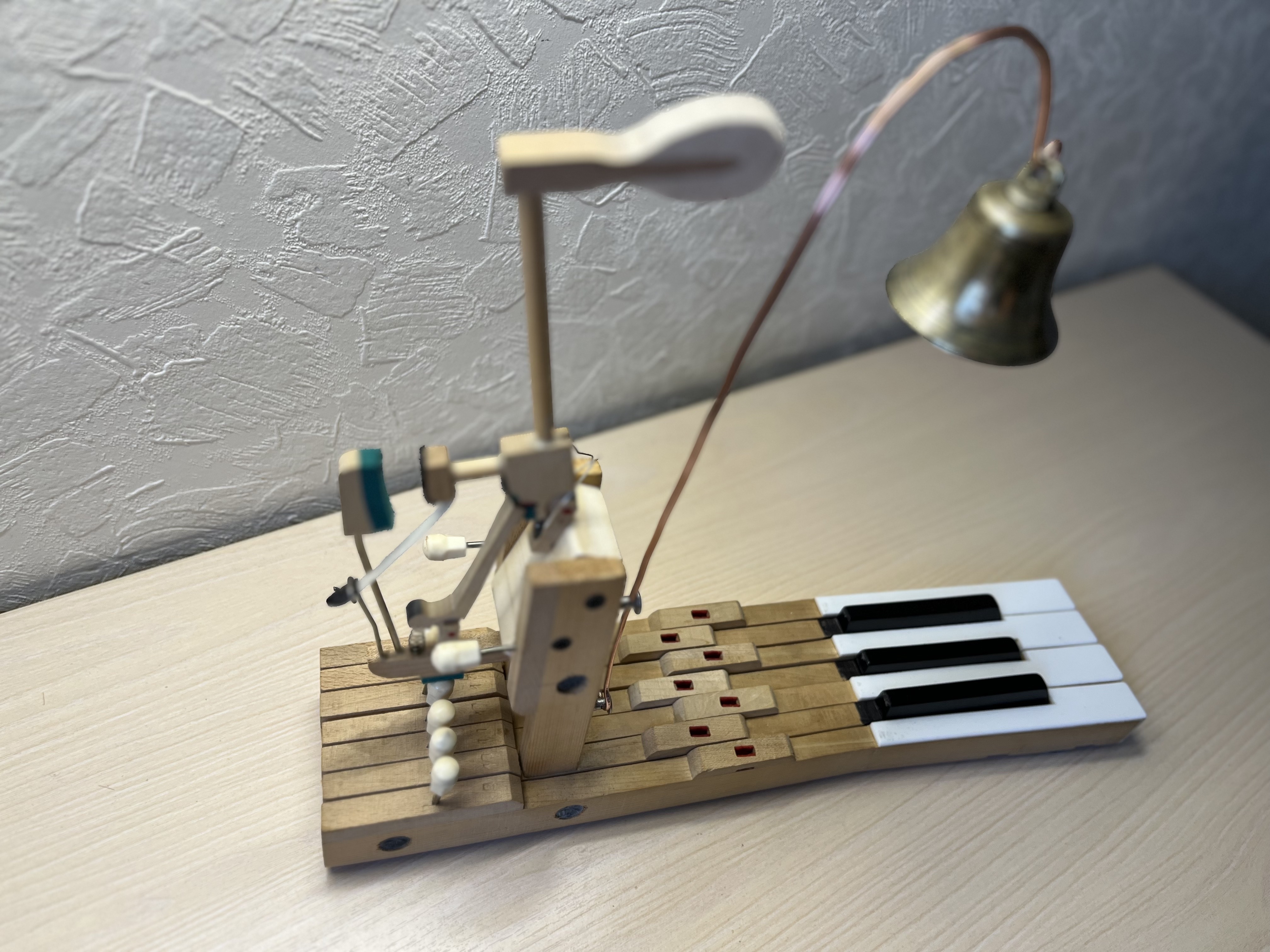 Table bell made of an old piano and an antique bell | Inspire Uplift