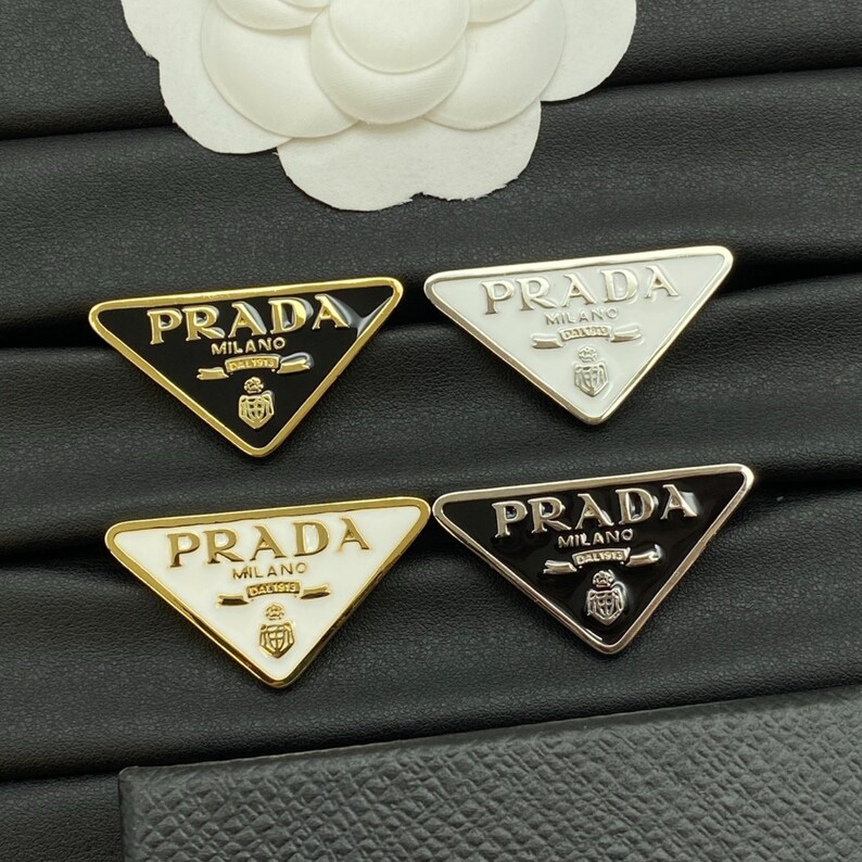 Prada Brooch - Iconic Luxury Accessory - prada brooch pin - | Inspire ...